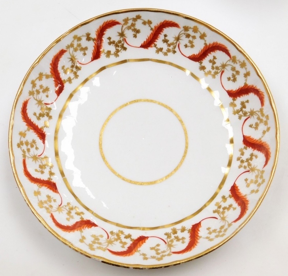 An early 19thC porcelain part tea service, of fluted form decorated in ...