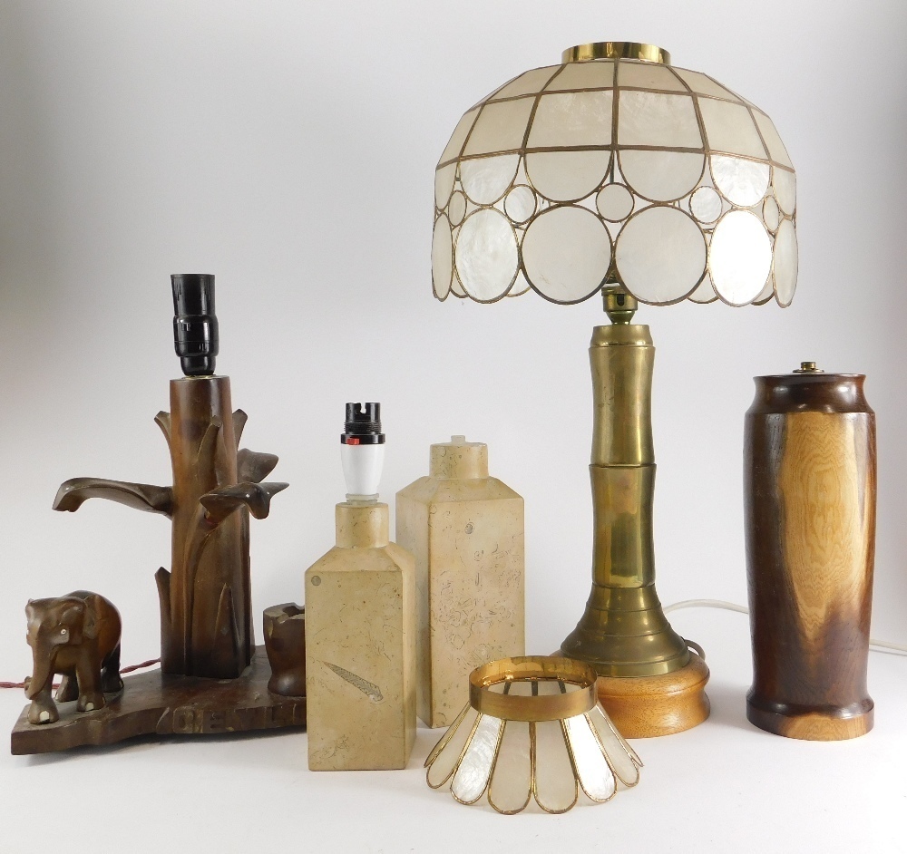 Two similar carved stone lamp bases, each engraved Lincoln 1972, a ...