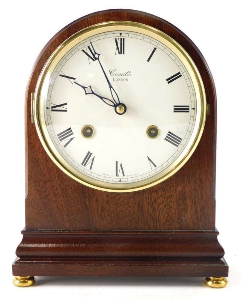 A Comitti London mahogany cased mantel clock, the domed case holding a ...