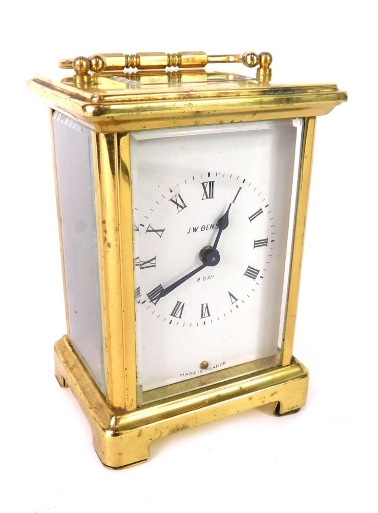 A 20thC French brass carriage clock, with swing handle and bracket feet ...