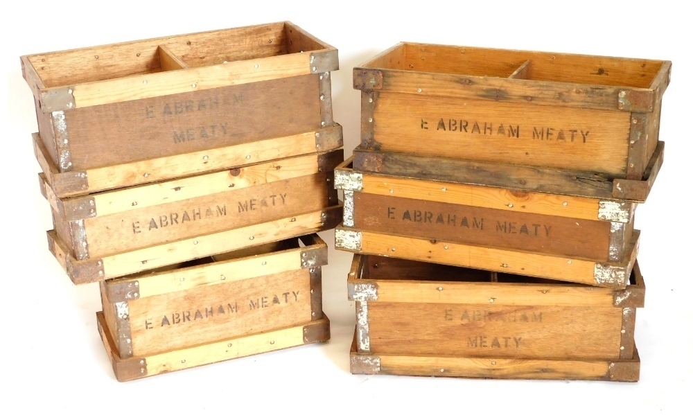 A collection of modern pine metal bound advertising boxes, with ...