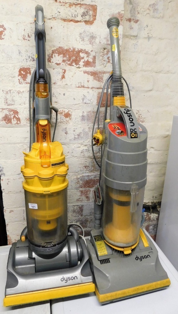 A Dyson upright vacuum cleaner, and a Dyson DC01 upright vacuum cleaner ...
