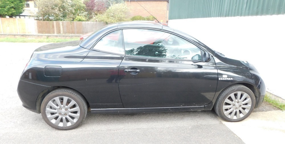 A Nissan Micra Essenza Convertible, Registration FY55 YNL, black ...