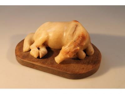 Ann Baxter ( 20th Century ) A carved alabaster figure of a lying horse