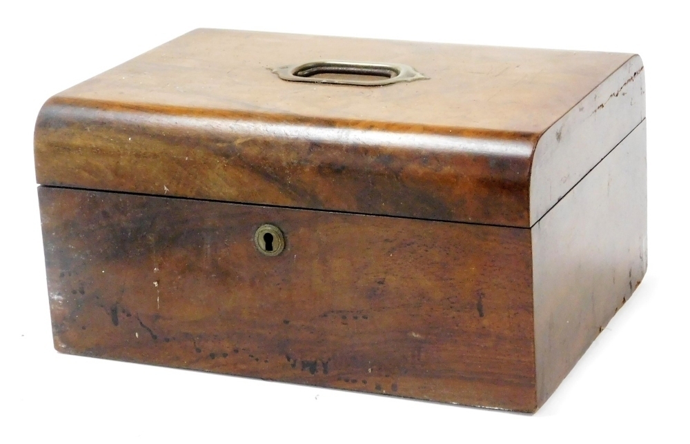 A Victorian walnut domed sewing box, containing sewing accoutrements ...