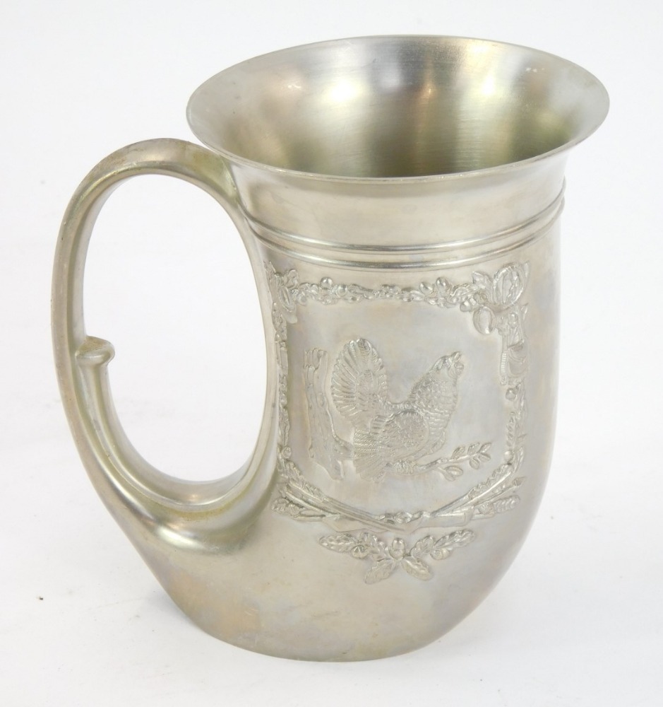 A Western Germany BMF pewter tankard, of horn shape and cast with panel ...