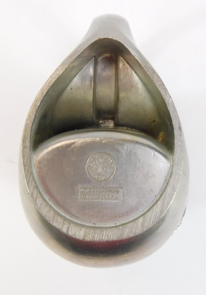 A Western Germany BMF pewter tankard, of horn shape and cast with panel ...