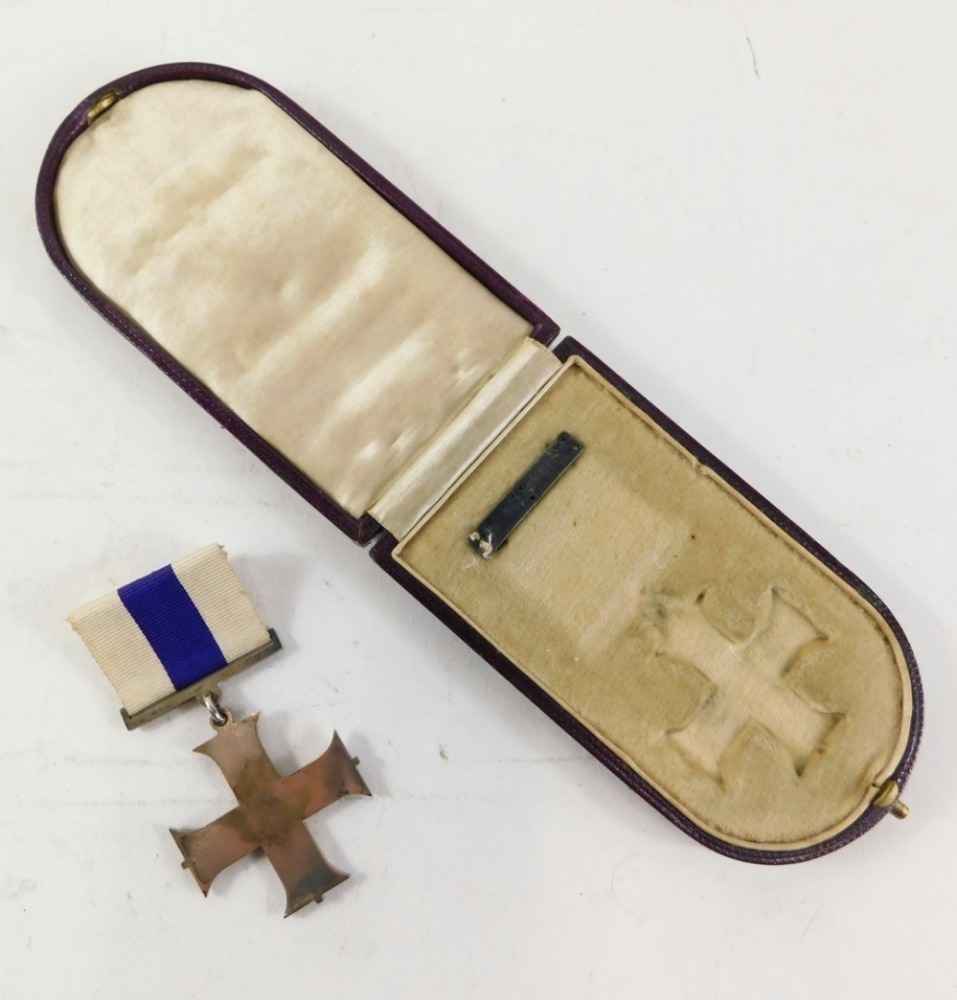 A cased military cross, with ribbon in purple case, with gilt ...
