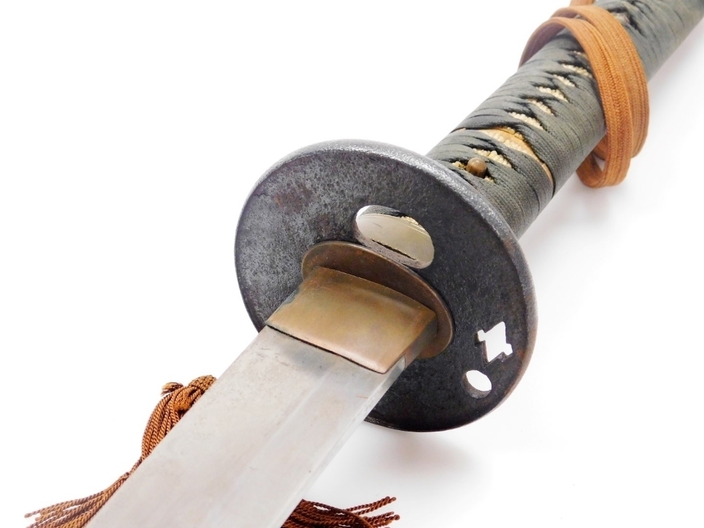 A Japanese katana sword, with plain pommels, shagreen and cord bound ...