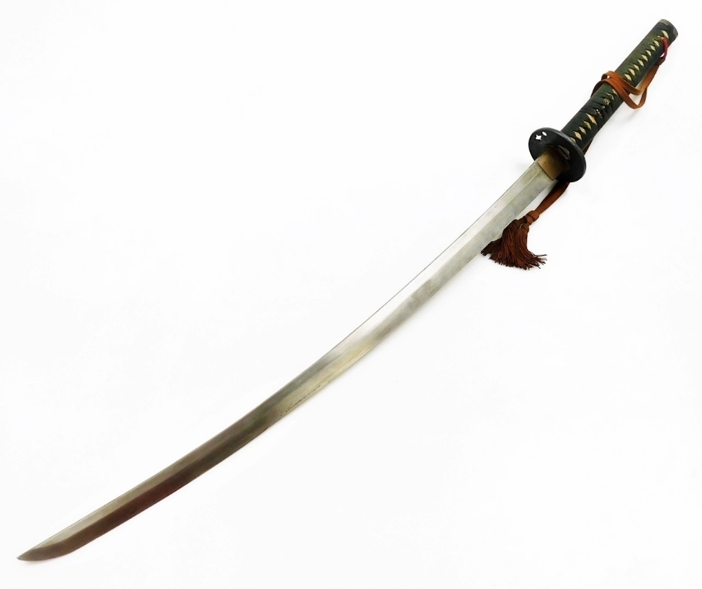 A Japanese katana sword, with plain pommels, shagreen and cord bound ...