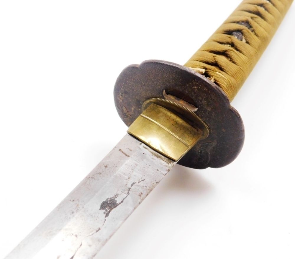 A Japanese katana sword, with bi metal cast pommels, shagreen and cord ...