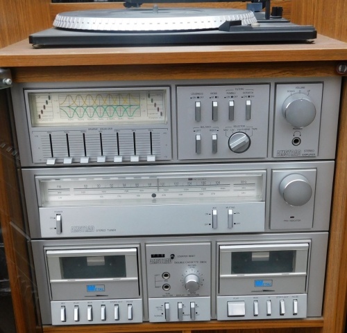 An Amstrad music system, with turntable, stereo tuner, double cassette ...