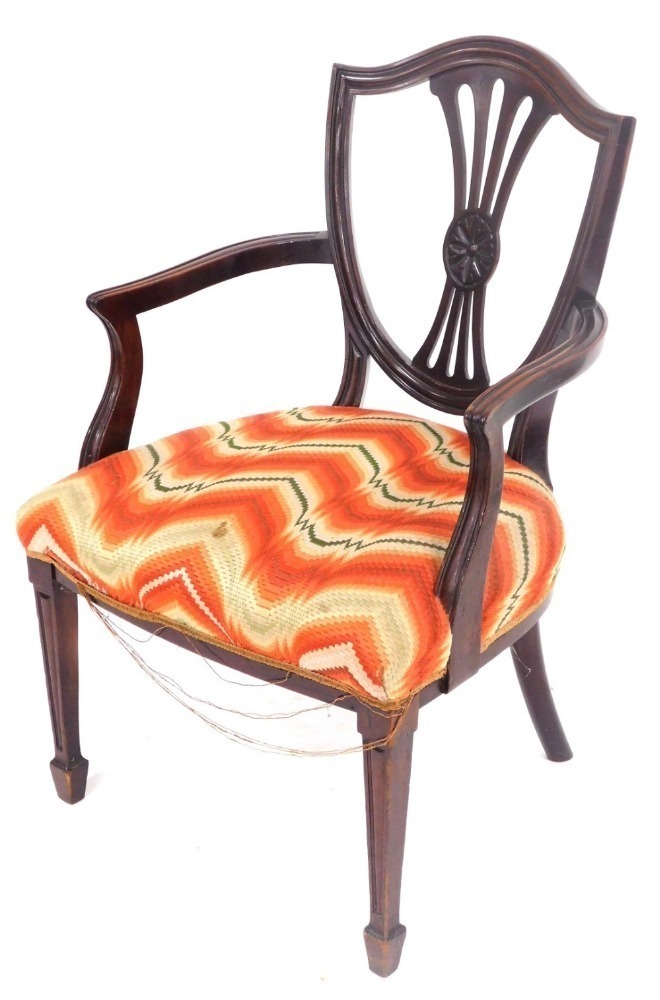 A Hepplewhite style mahogany shield back carver chair, with an ...