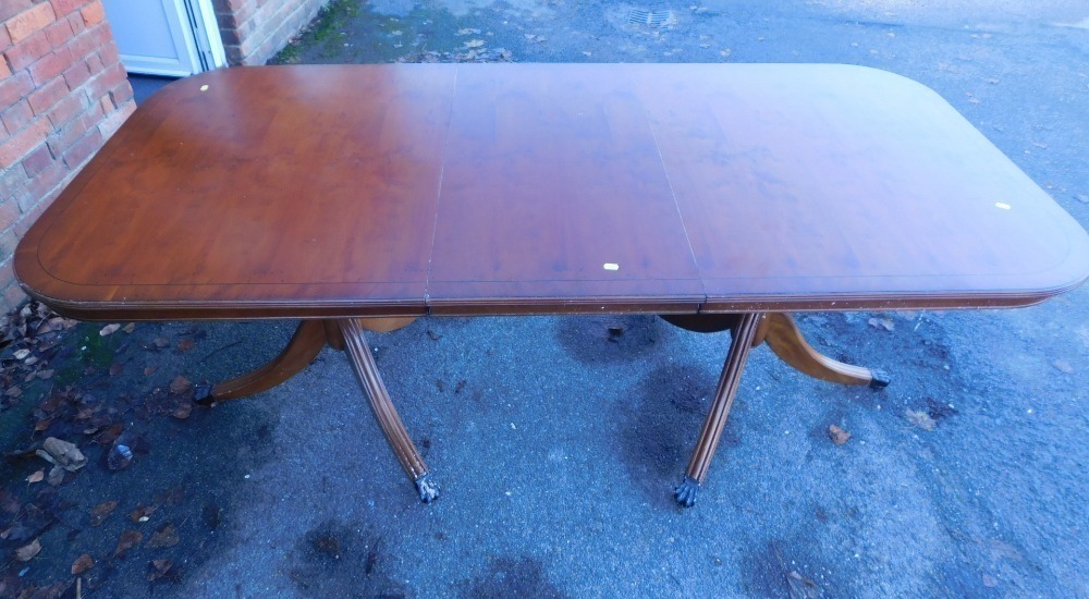 A reproduction twin pedestal dining table, with two additional leaves.