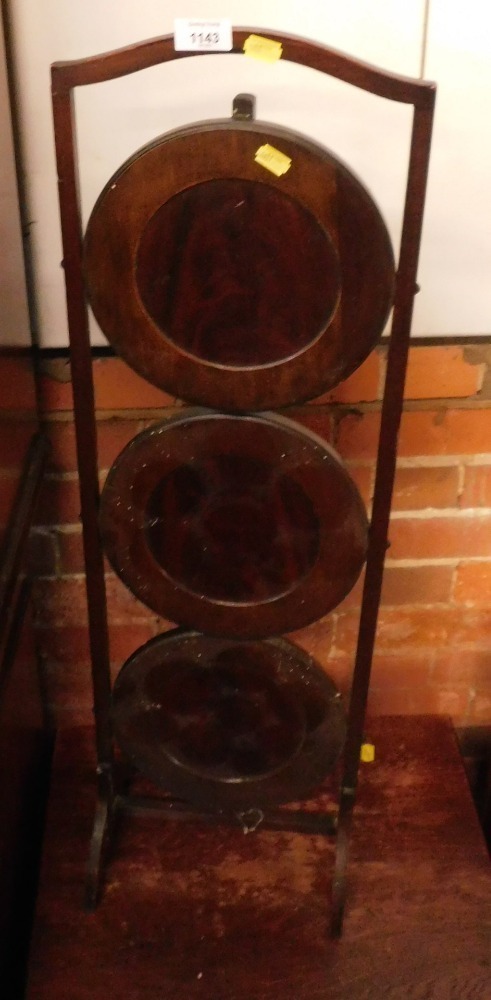 A three tier folding cake stand.