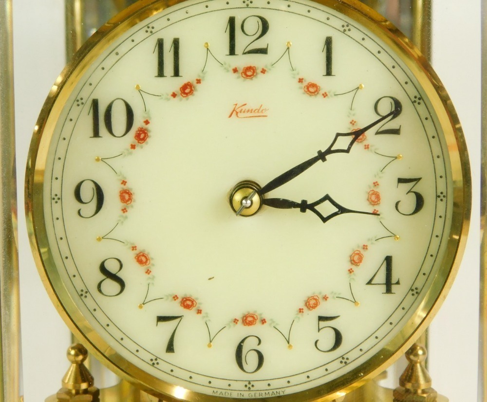 A Kundo brass cased hexagonal anniversary clock, with a cream numeric ...