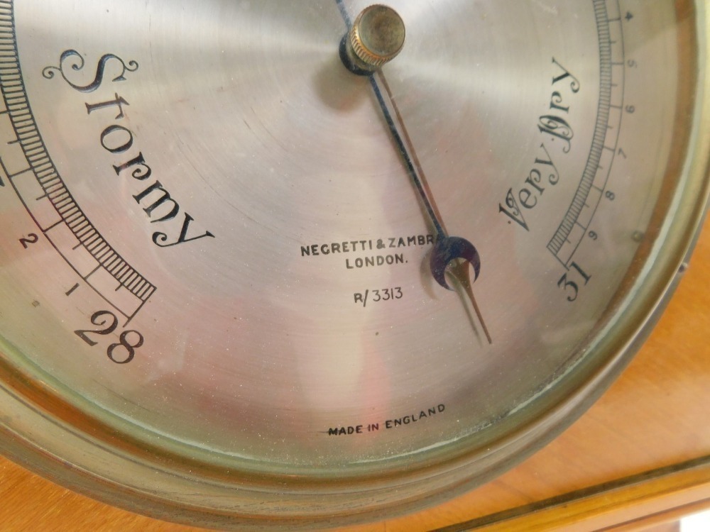 A mid 20thC walnut cased barometer by Negretti & Zambra, London, R/3313 ...