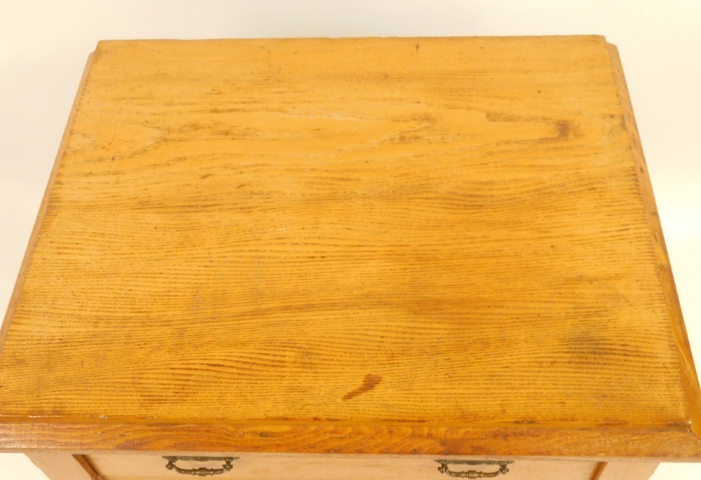 A 19thC ash six drawer Wellington chest, with swing handles, on plinth ...