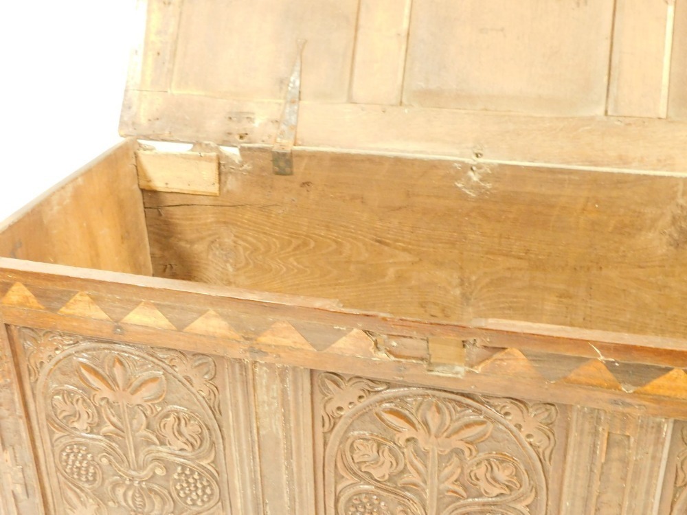 A late 17thC/early 18thC oak coffer, with a single panel top and an ...